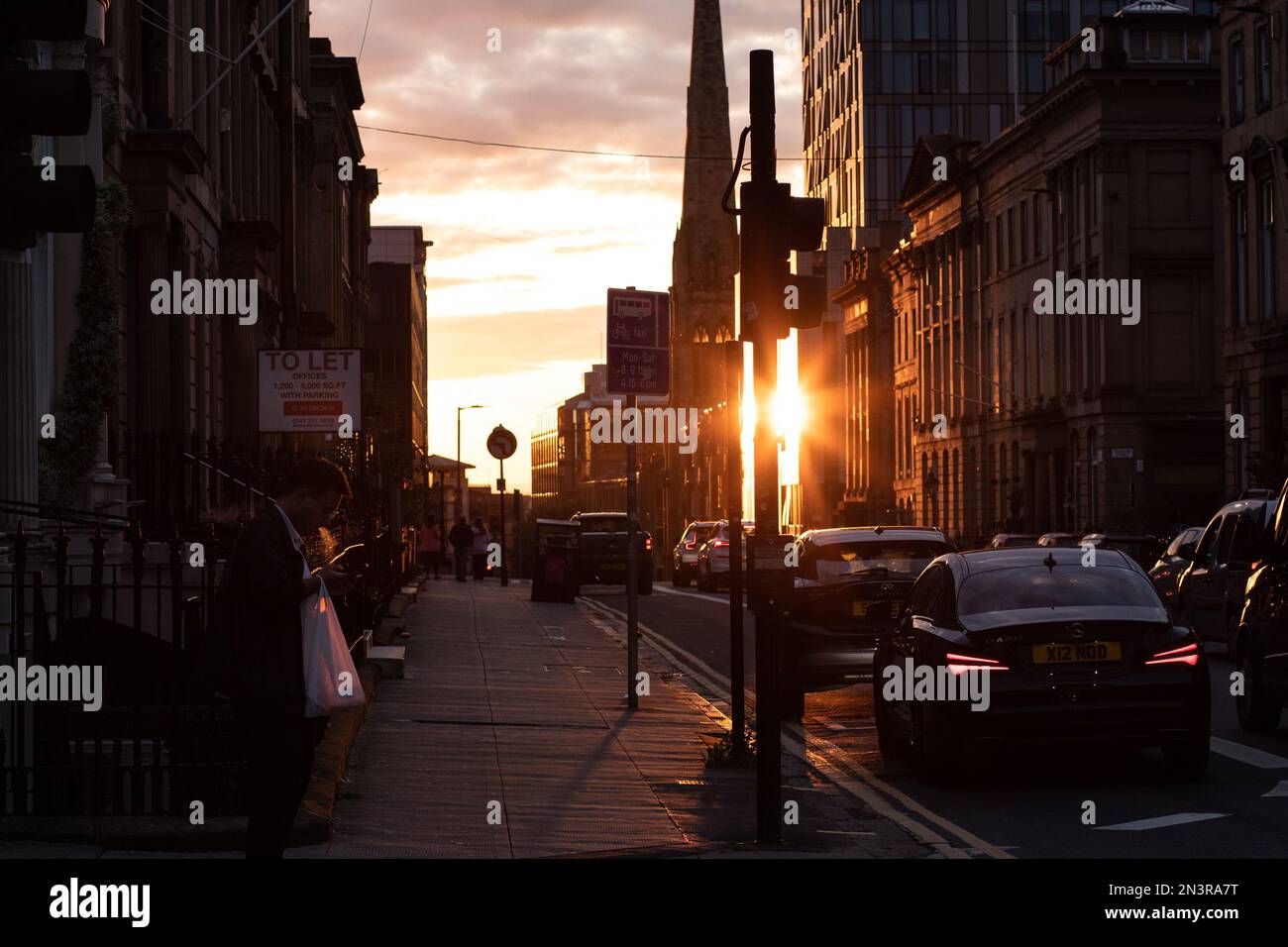Sunset and a Man Smoking a Cigarette, Glasgow Scotland Stock Photo - Alamy