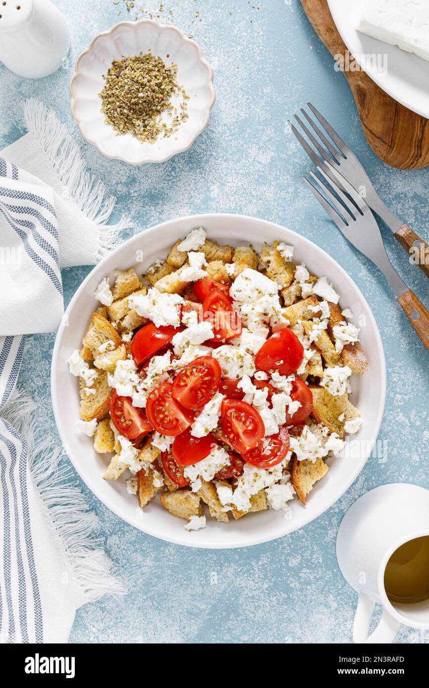 Dakos or koukouvagia salad. Classic recipe Cretan barley rusk salad ...