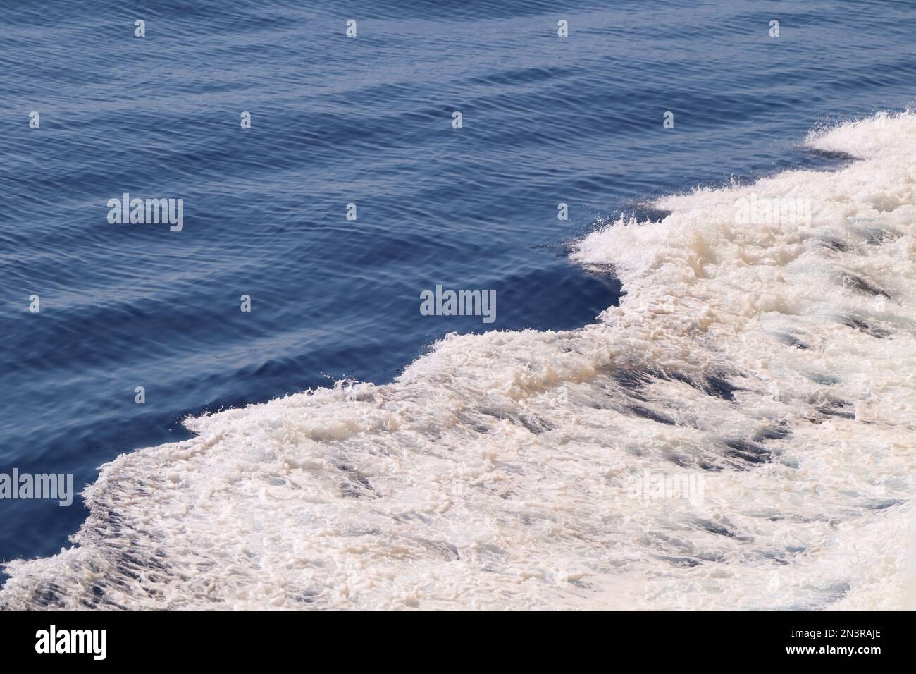 A top view of the sea waves splashing over the shore perfect for ...
