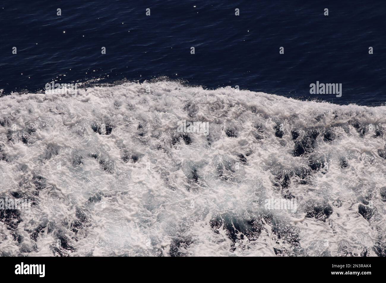 A top view of the sea waves splashing over the shore perfect for ...