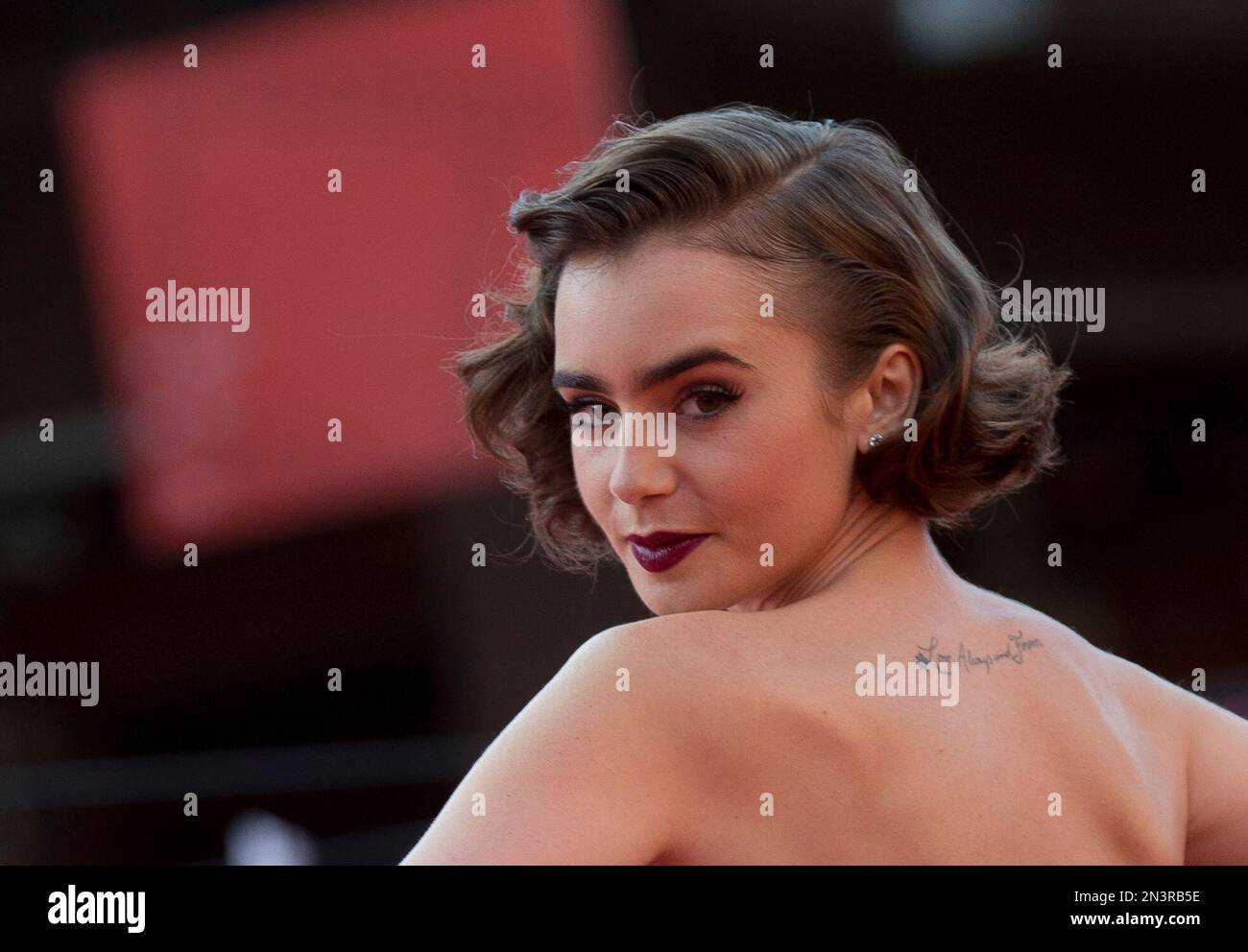 Actress Lily Collins poses for photographers as she arrives on the red ...