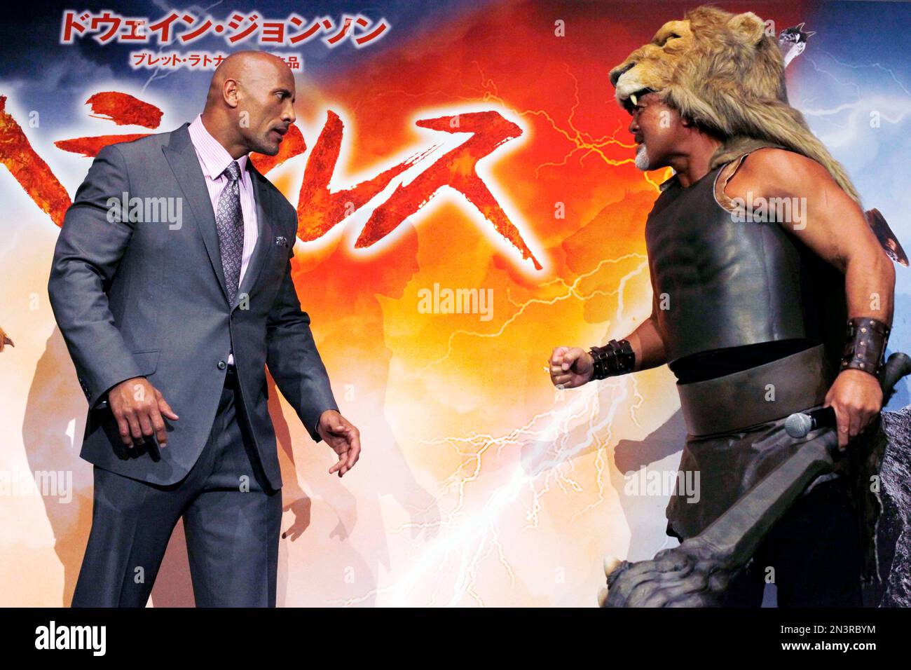 American actor Dwayne Johnson, left, pretends to fight Japanese ...