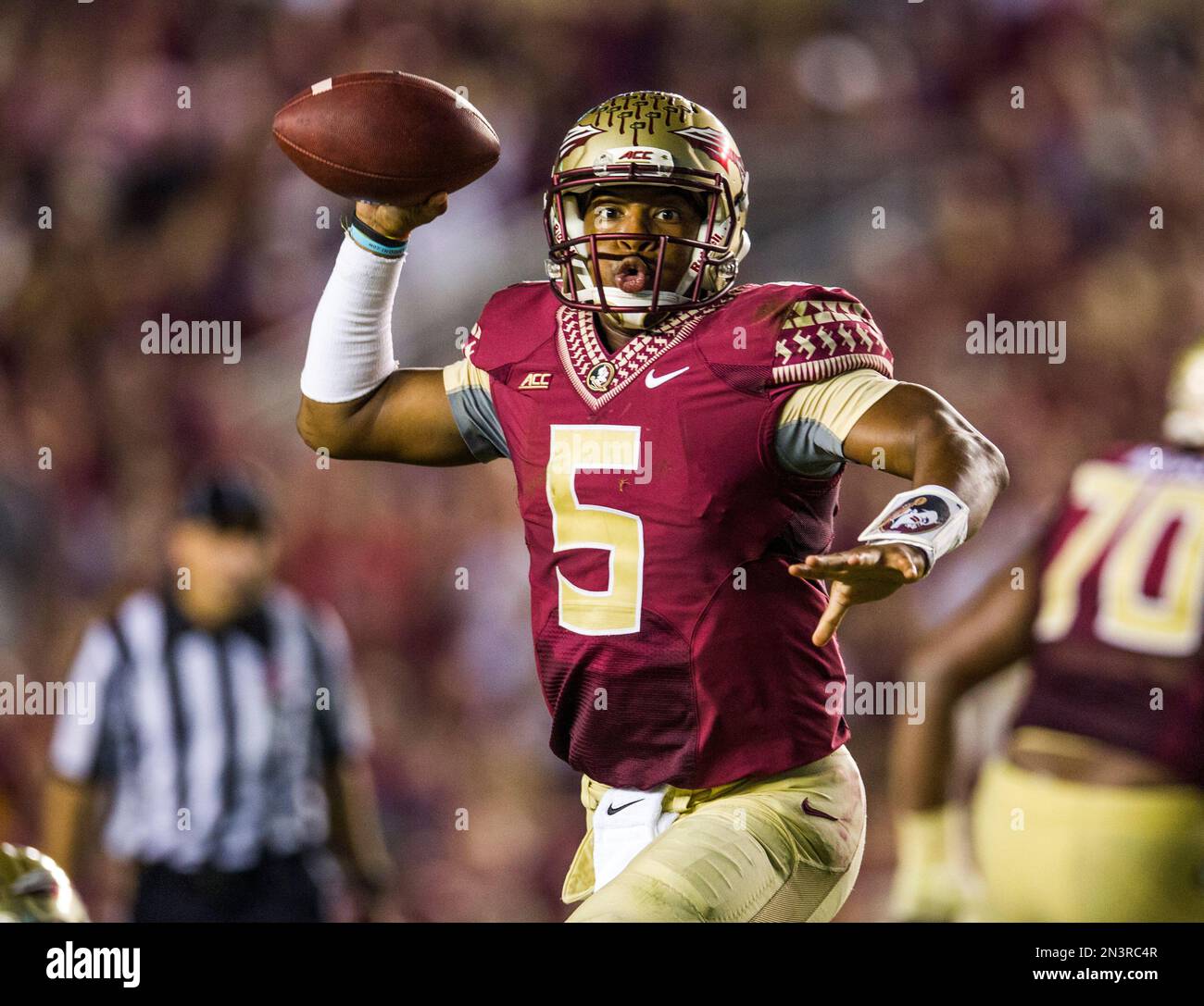 Florida State quarterbacks rolls out to pass in the second half of an ...
