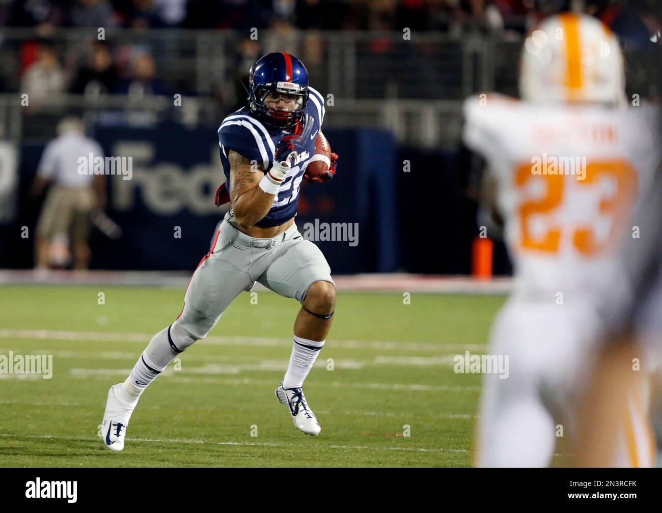Mississippi quarterback Bo Wallace (14) runs the ball upfield past a ...
