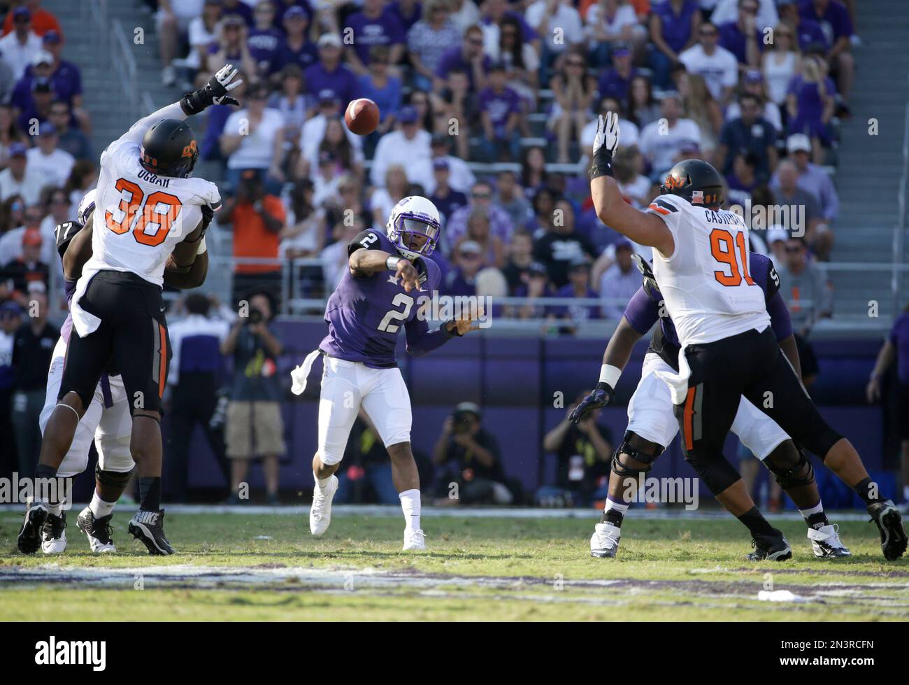 Oklahoma State defensive end Emmanuel Ogbah (38) and defensive tackle ...
