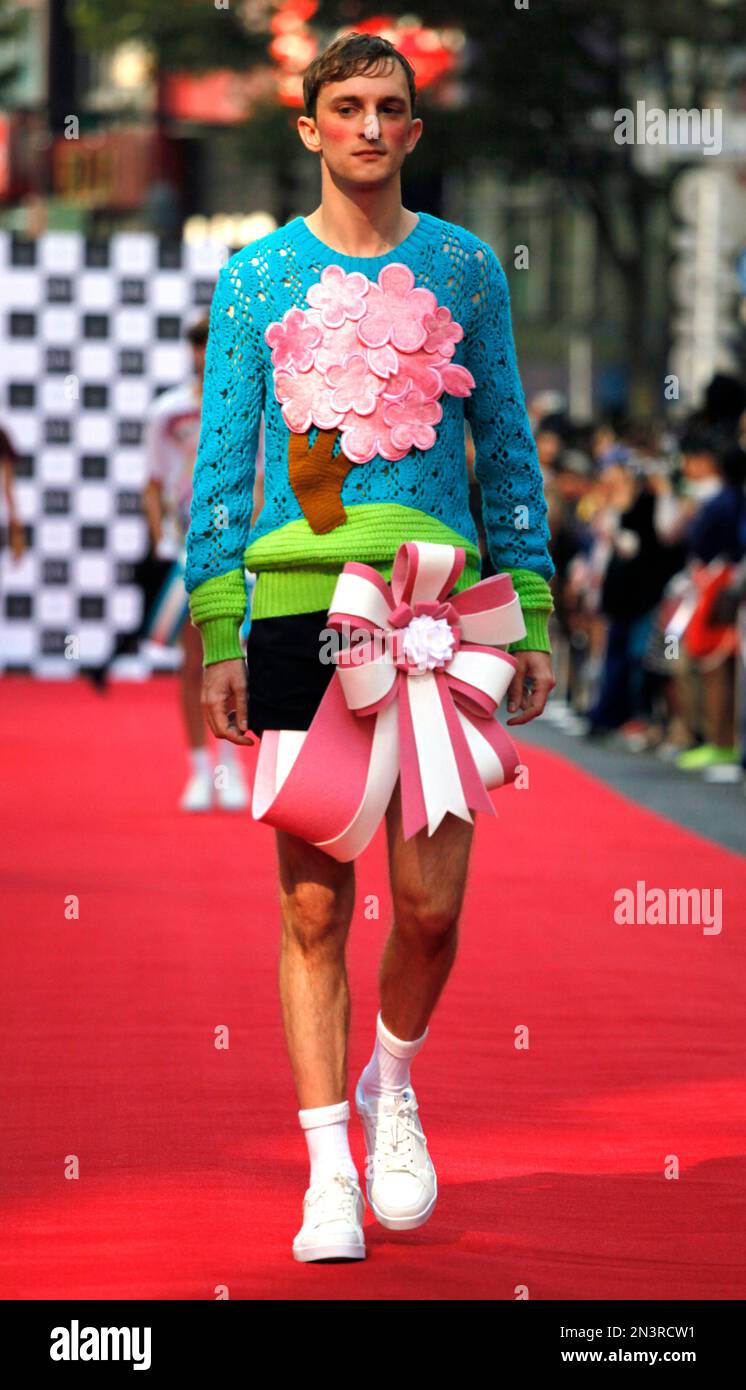 A model displays a creation by Japanese fashion designers during a ...