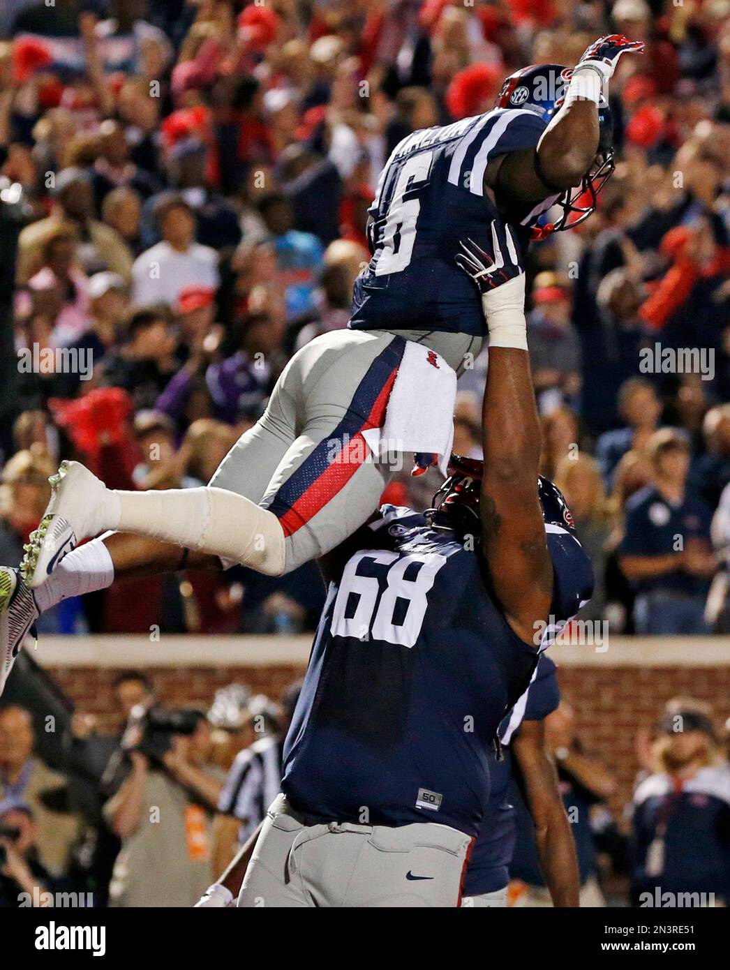 Mississippi offensive lineman Justin Bell (68) lifts running back ...