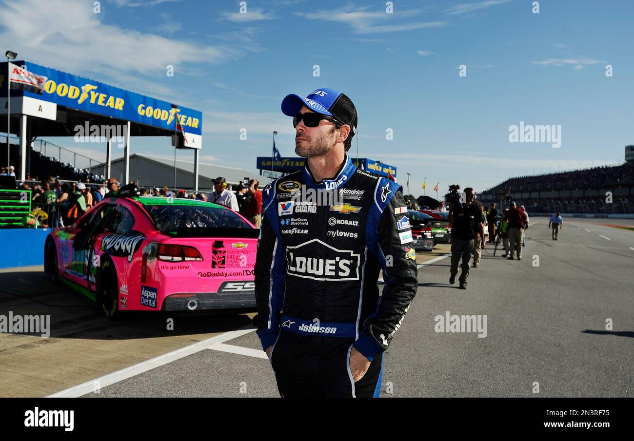 Jimmie Johnson walk through the pits before qualifying for Sunday's ...