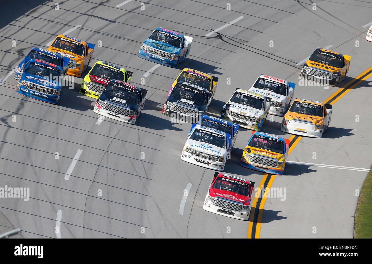 Driver Timothy Peters (17) leads the field to the finish line on the ...