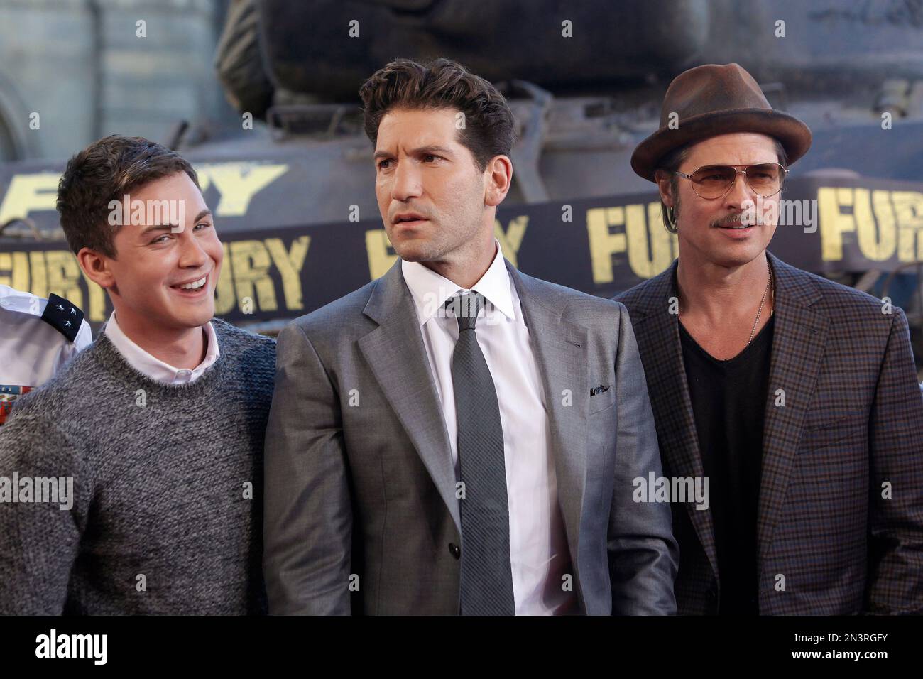 Actors Logan Lerman, left, Jon Bernthal, center, and Brad Pitt pose for ...