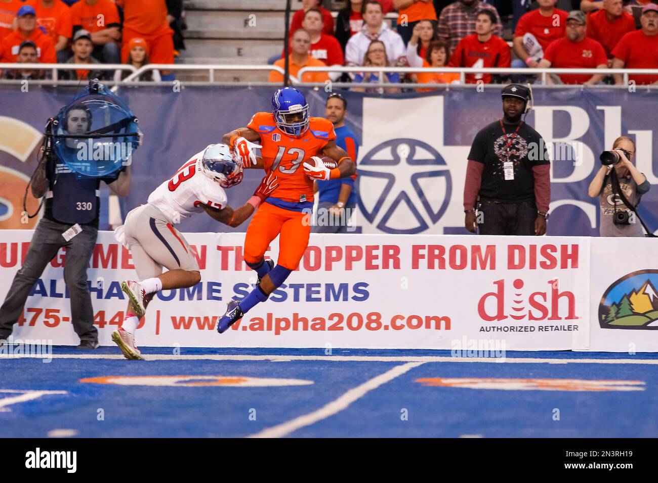 Boise State running back Jeremy McNichols (13, right) is brought down ...