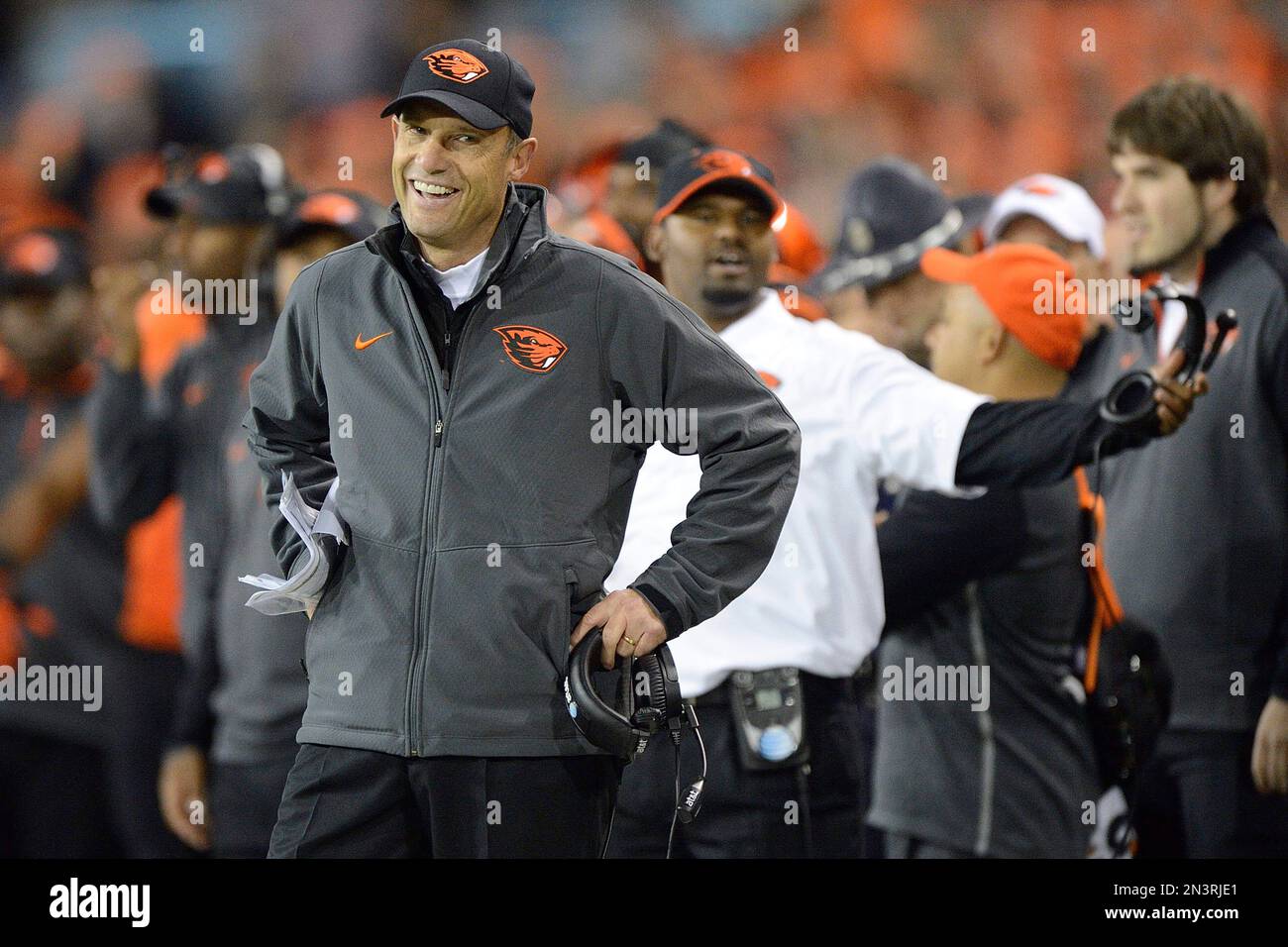 Oregon State University football coach Mike Riley smiles at an official ...
