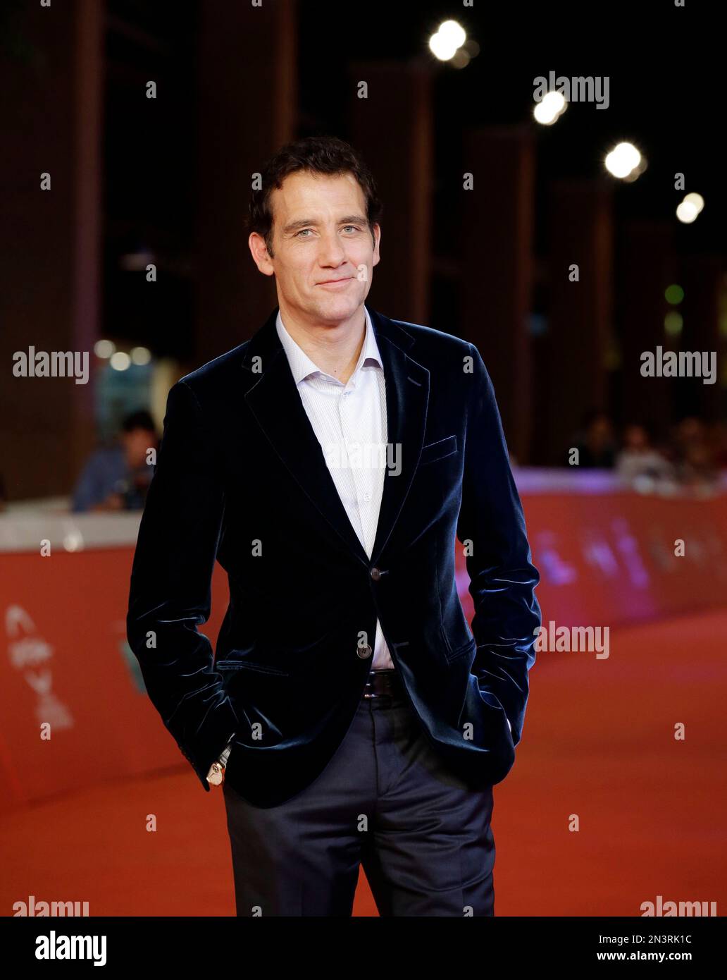 Actor Clive Owen poses for the photographers as he arrives on the red ...
