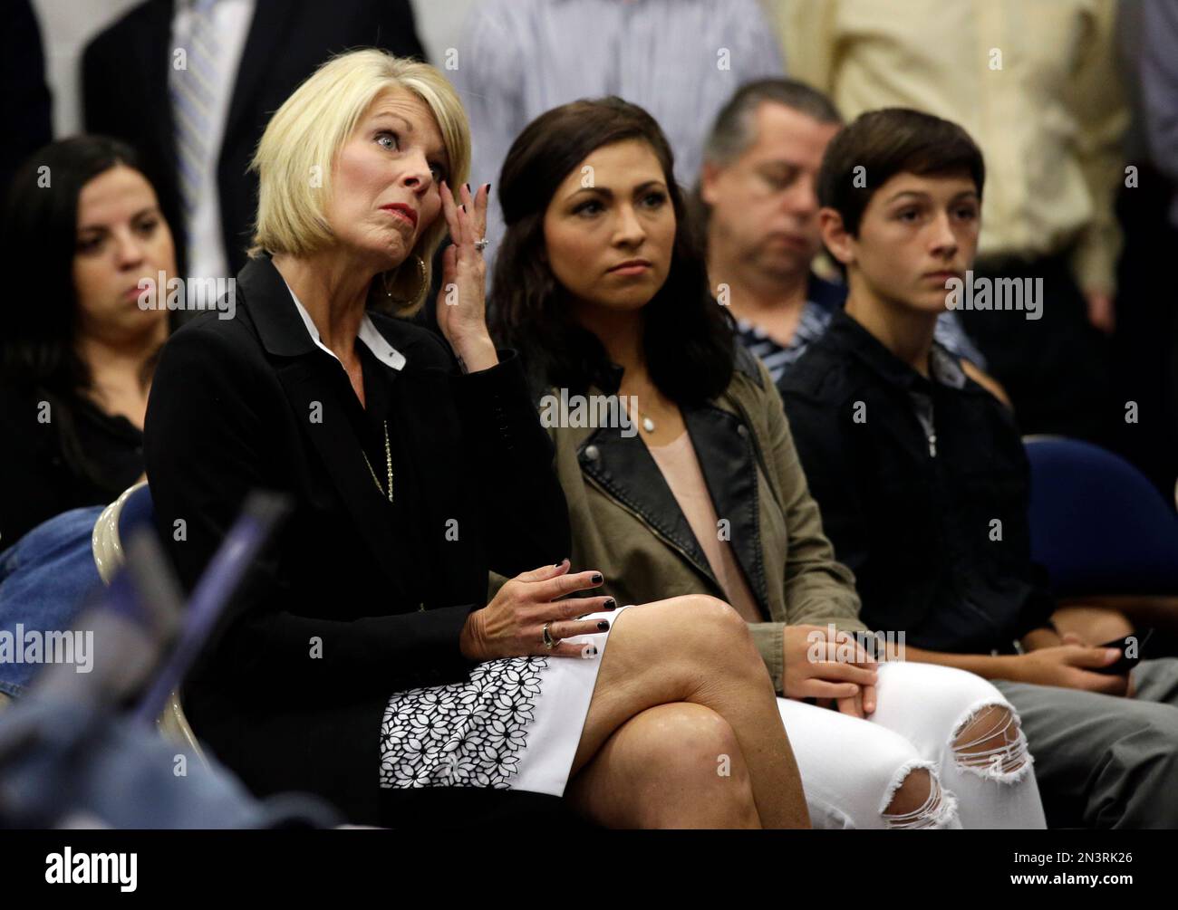 Karen Banister, left, wipes tears from her eyes as her husband, Texas ...