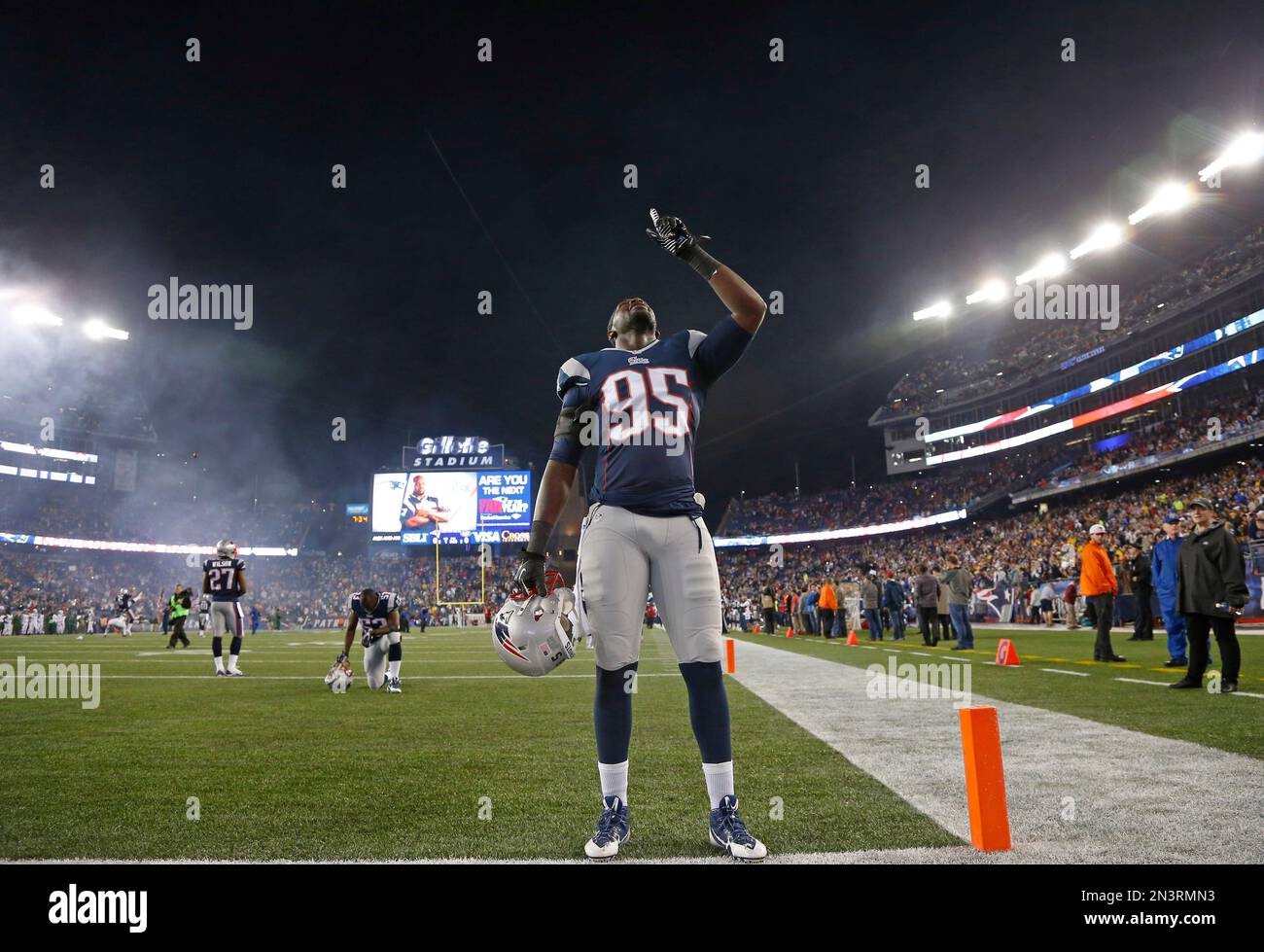 New England Patriots defensive end Chandler Jones (95) points skyward ...