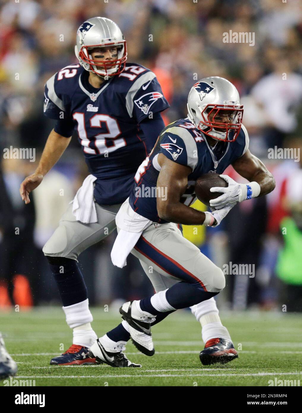 New England Patriots quarterback Tom Brady (12) hands off to ...
