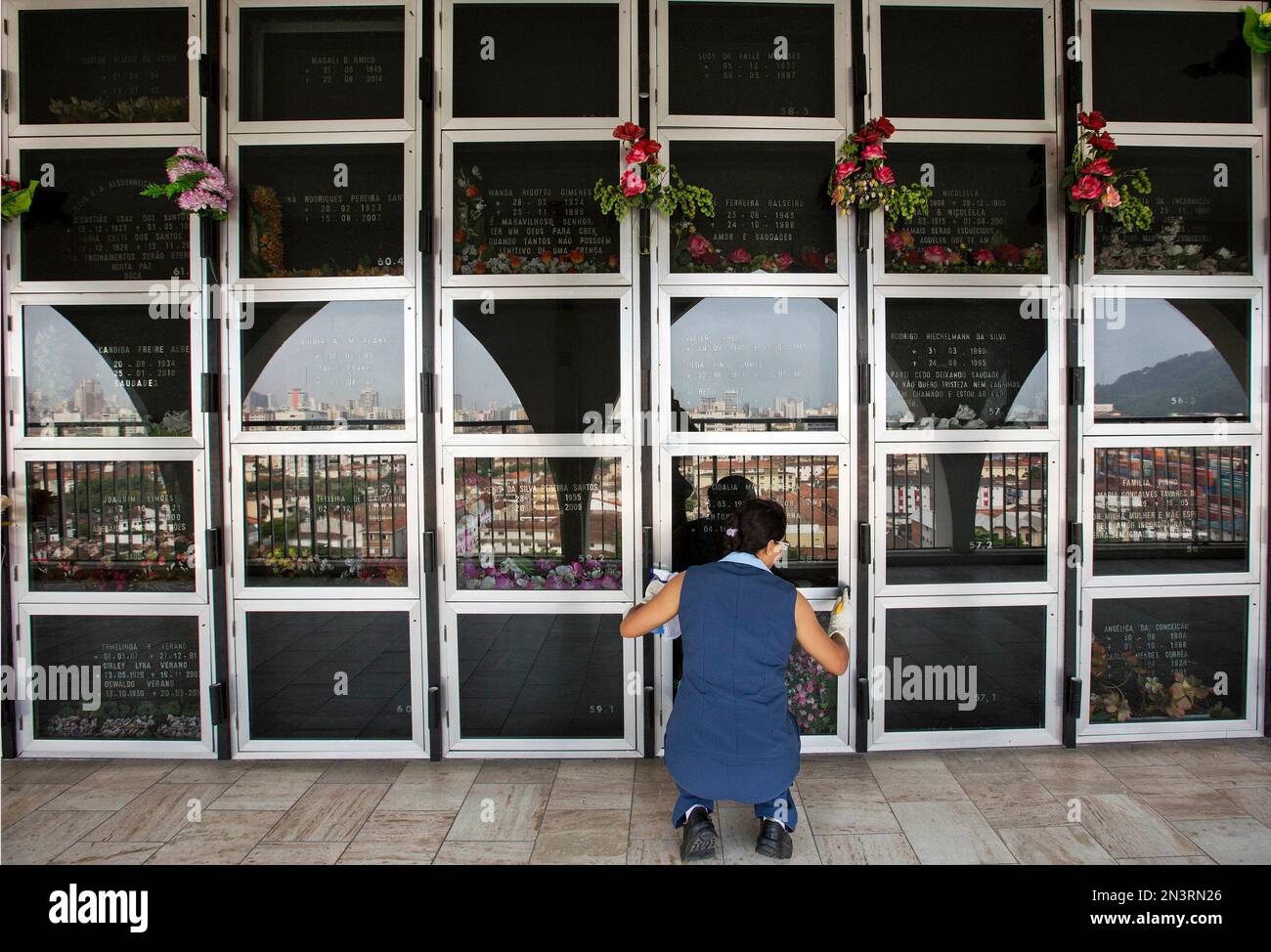 In this Oct. 13, 2014 photo, an employee at the Necropole Ecumenica ...