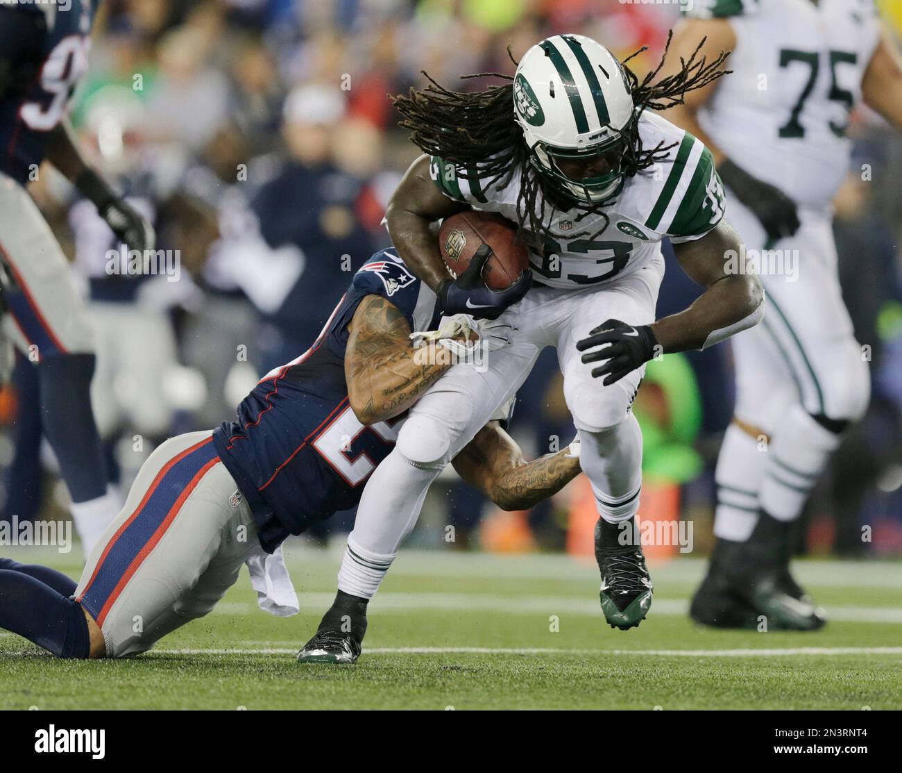 New England Patriots strong safety Patrick Chung, left, tackles New ...