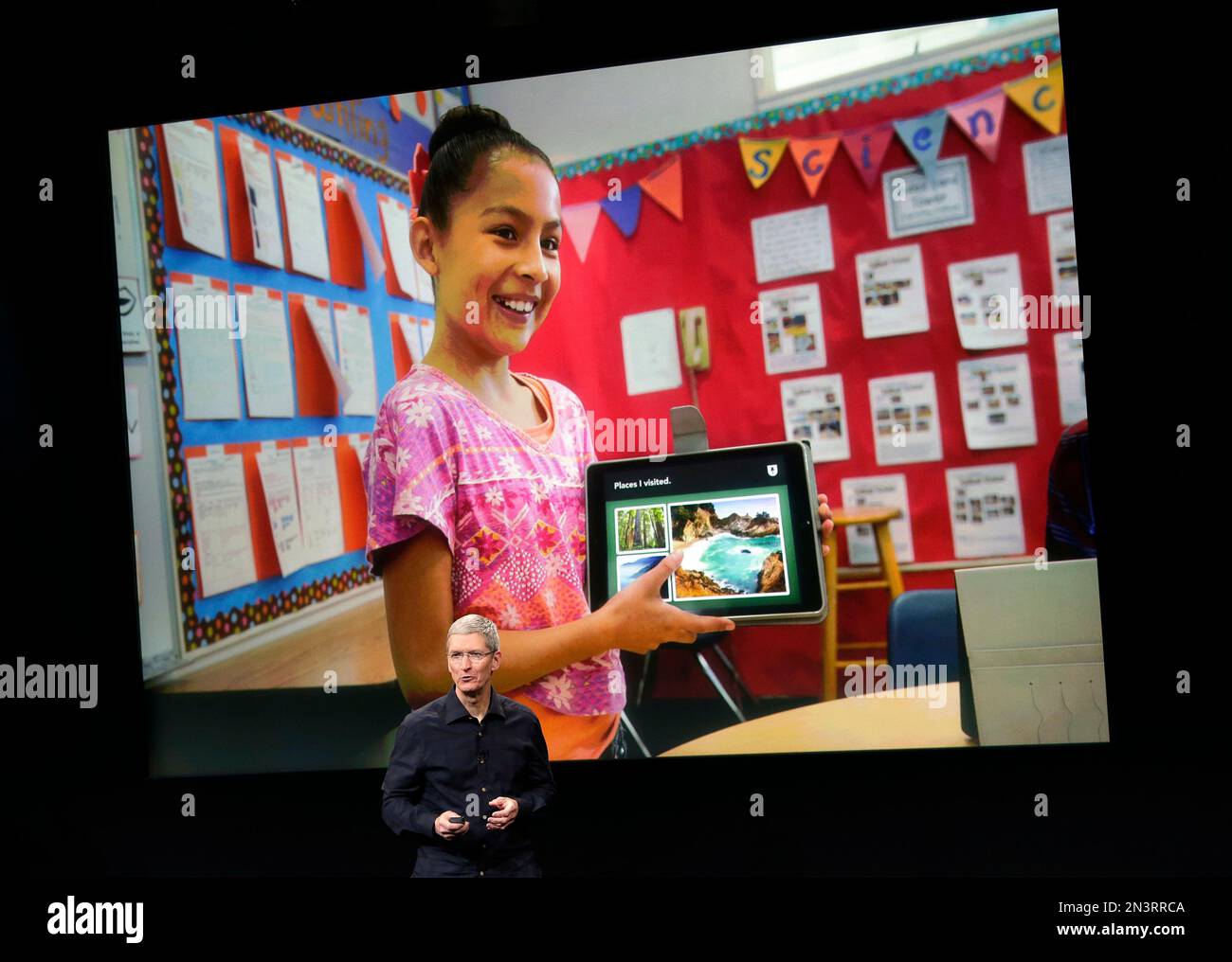 Apple CEO Tim Cook introduces the new Apple iPad Air 2 during an event ...