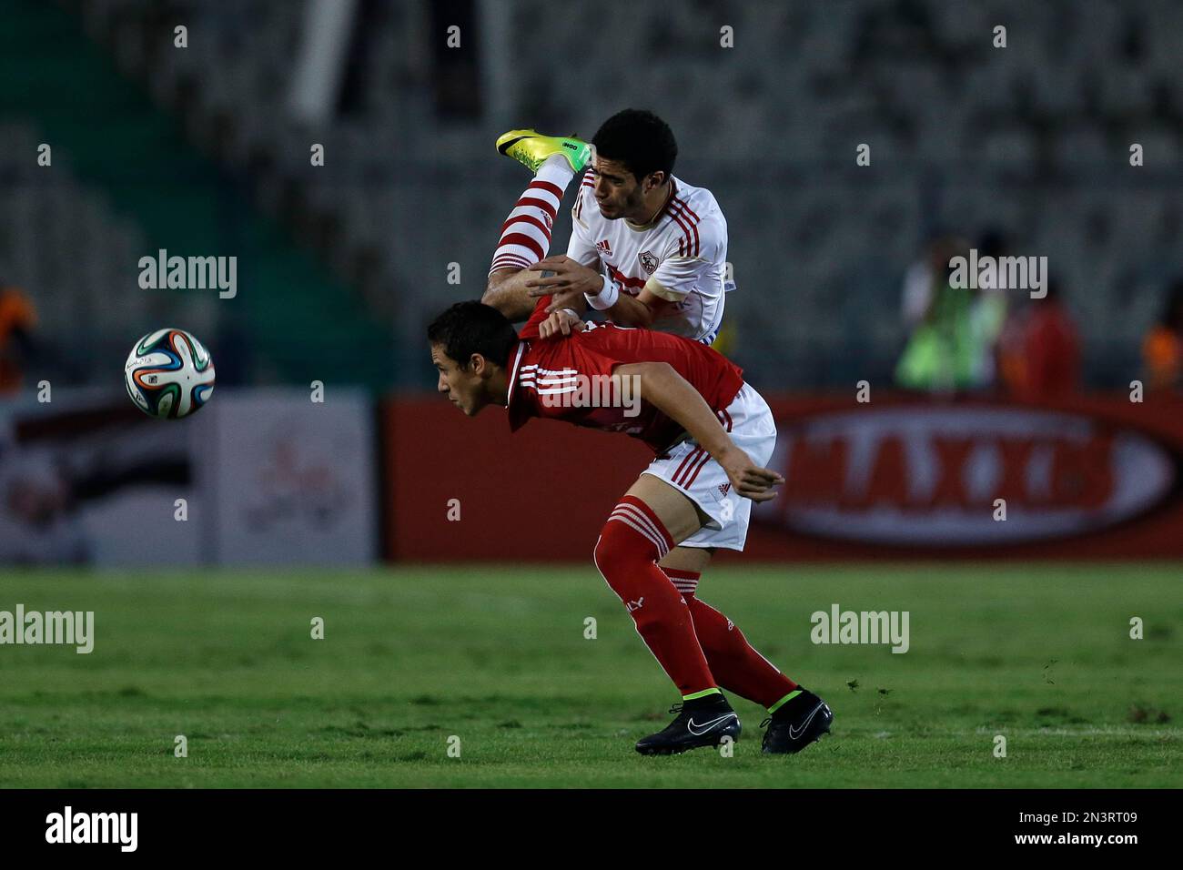 In this Sunday, Sept. 14, 2014 photo, Zamalek's Omar Gaber, top, and Al ...