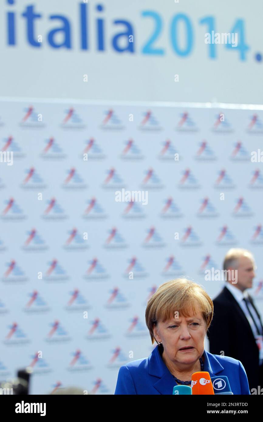 German Chancellor Angela Merkel answers a reporter's question as she ...