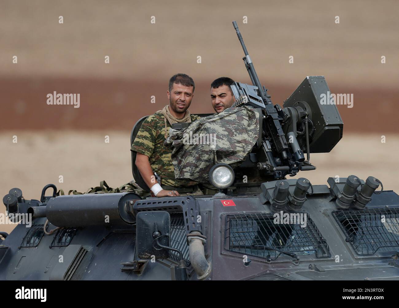 Turkish forces soldiers on their armoured vehicle patrol on the ...