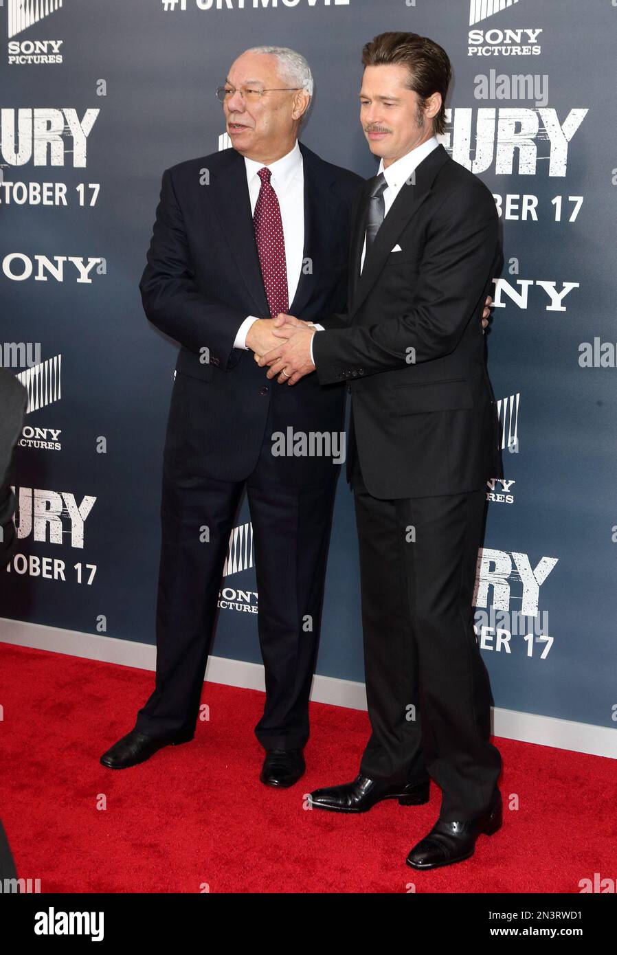 Retired General Colin Powell, left, and actor Brad Pitt arrive for the ...