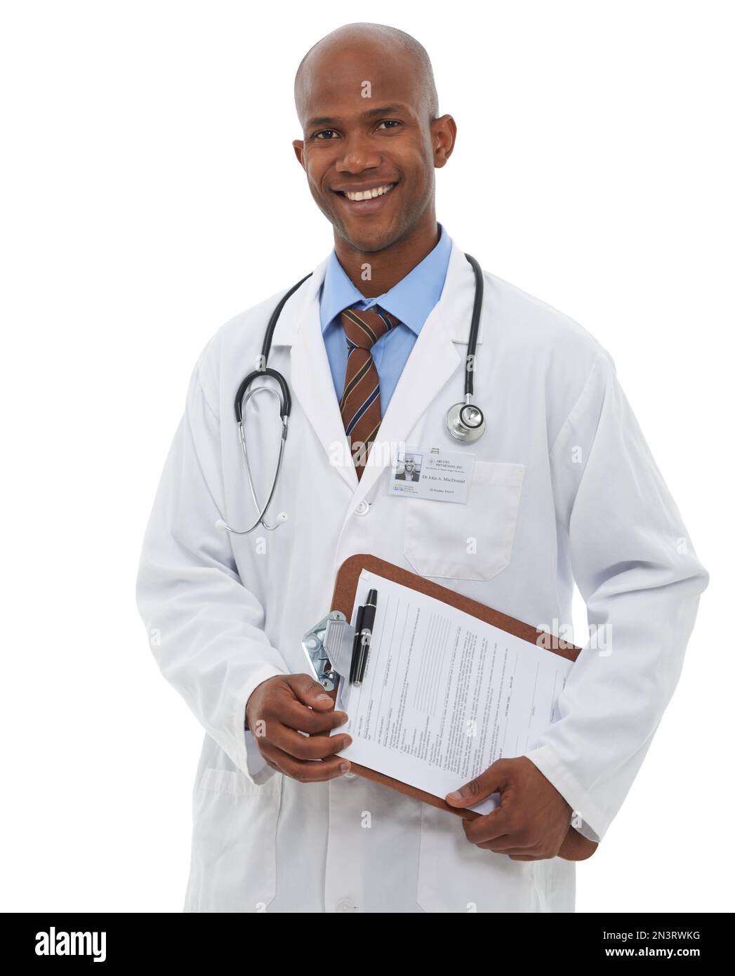Ready for the next patient. A handsome young doctor holding documents ...
