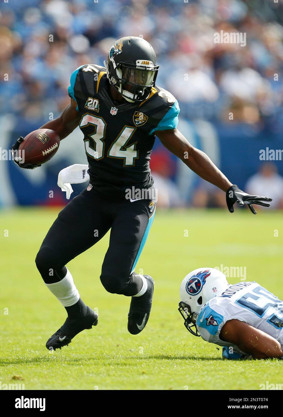 Jacksonville Jaguars running back Storm Johnson (34) tries to avoid ...
