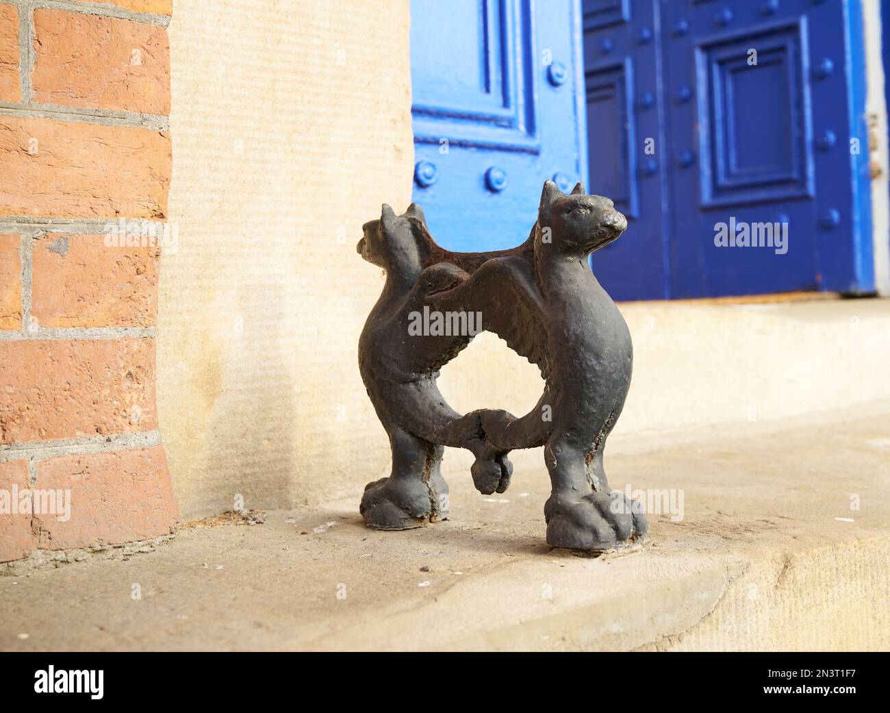 Old cast iron ornamental boot scraper outside a front door Stock Photo ...