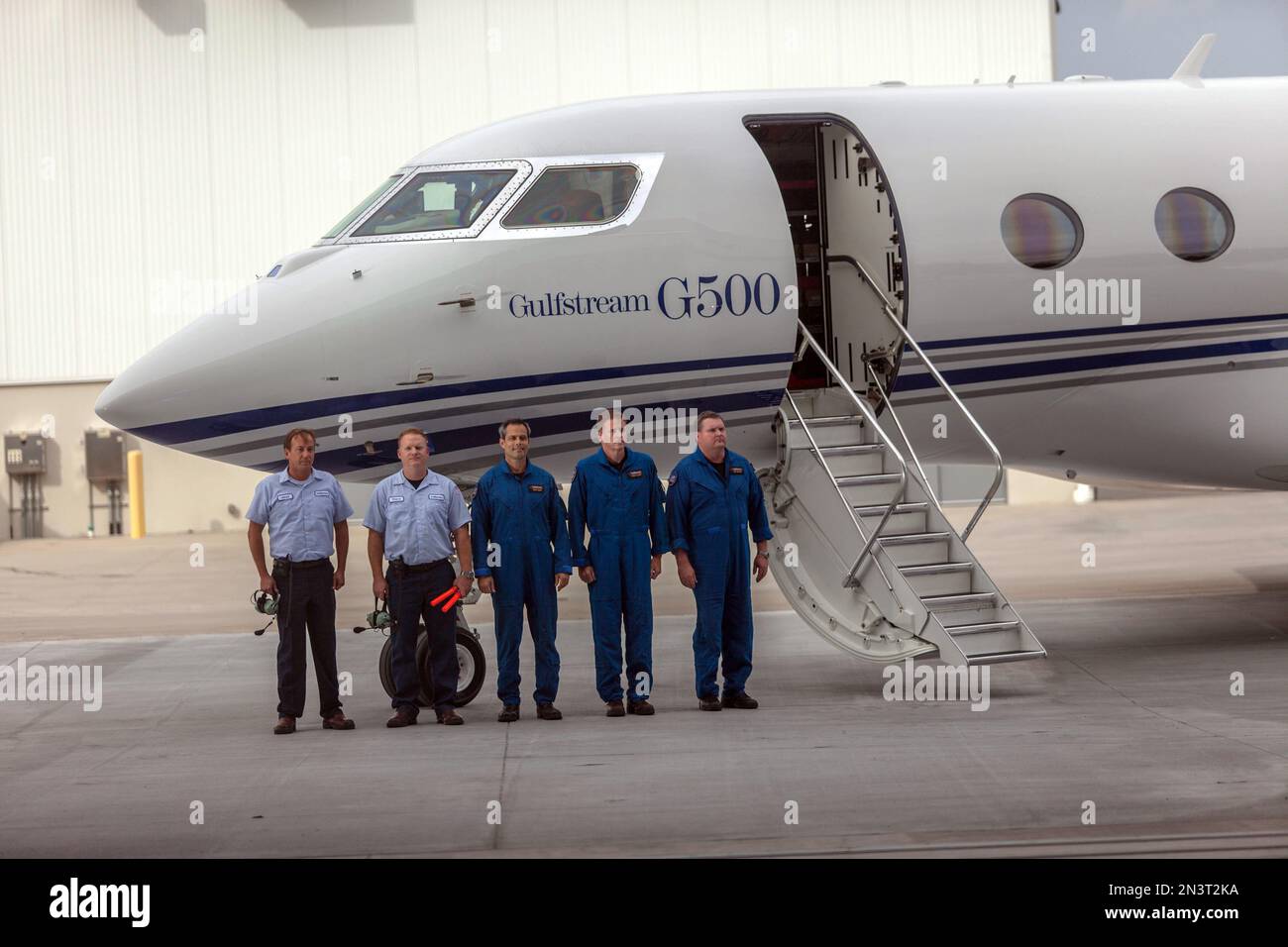 Flight crew members stand alongside the new Gulfstream G500, which was ...