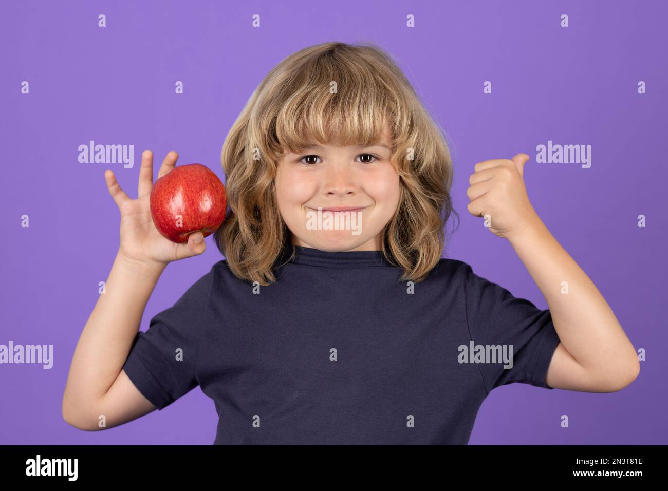 Red apple. Smiling child with thumbs up hold apple. Portrait of of cute ...