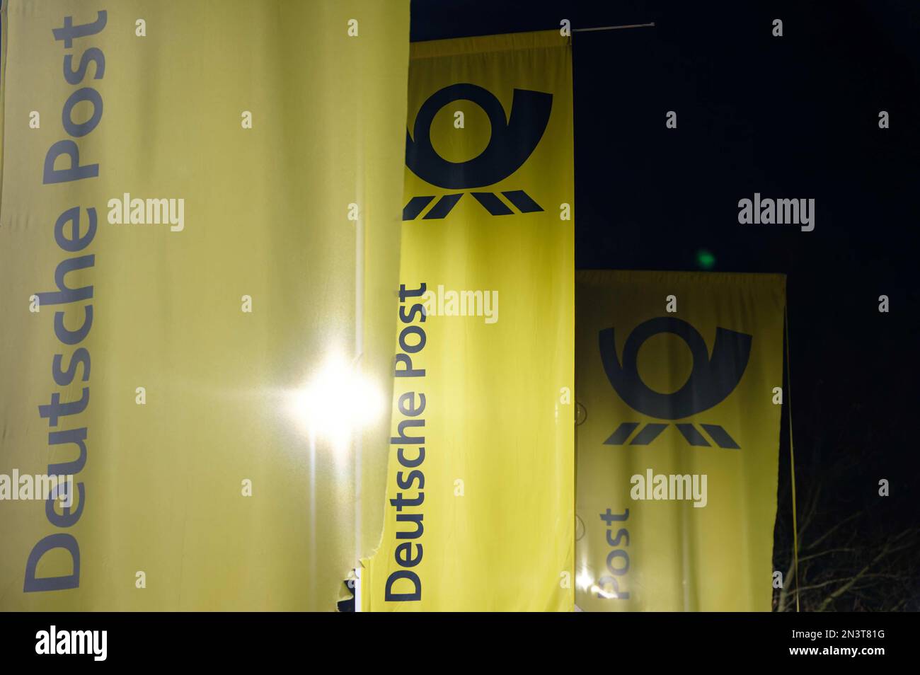 Cologne, Germany. 08th Feb, 2023. Deutsche Post flags stand in front of ...