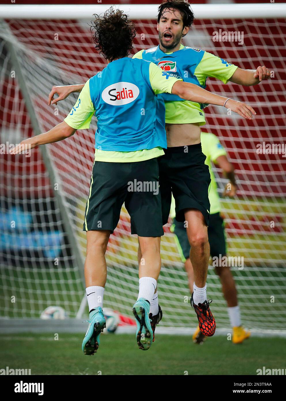 Brazil's Kaka, right, chest bumps his teammate after scoring a goal ...
