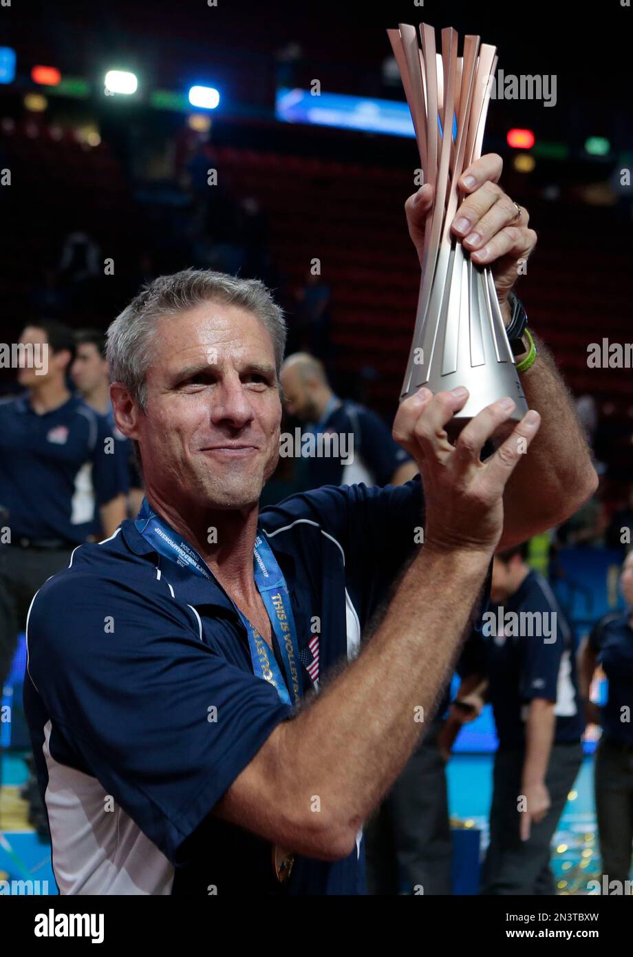 United States coach Karch Kiraly holds the trophy at the end of the ...