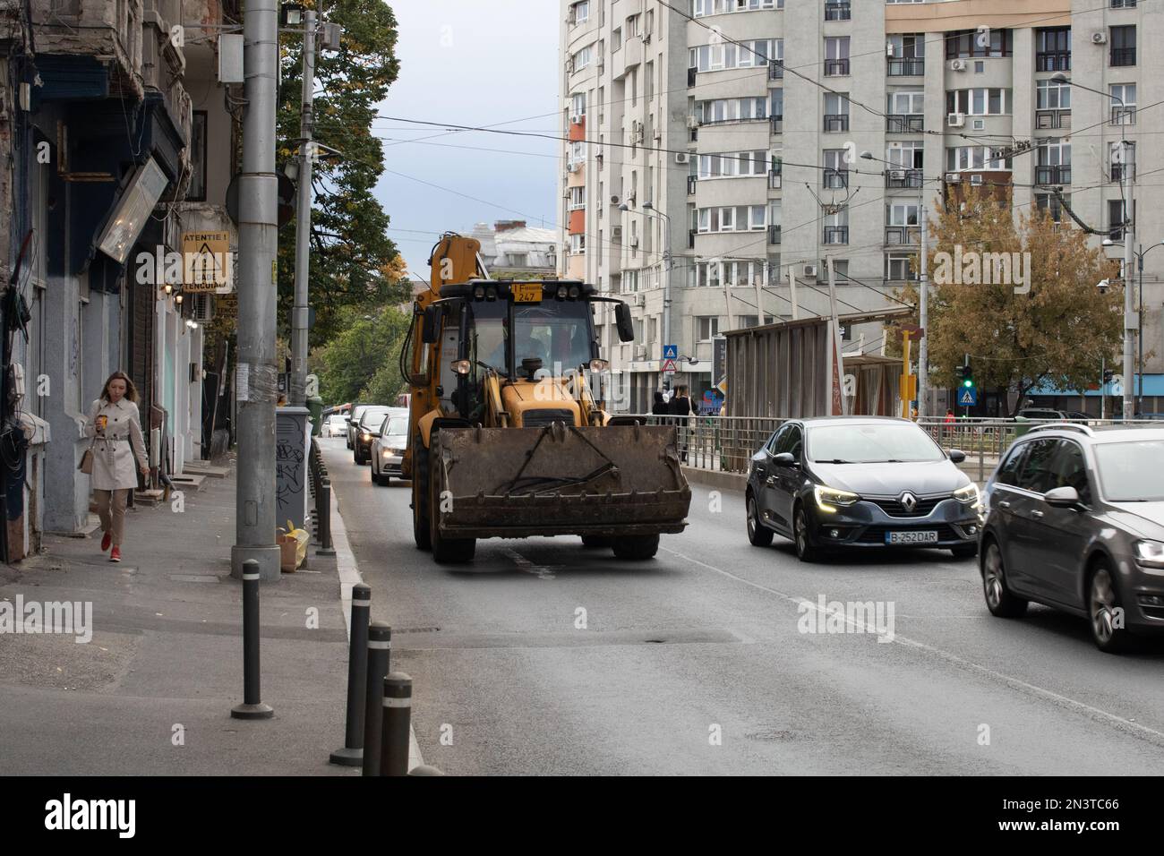 Construction workers at construction site and heavy duty bulldozer in ...