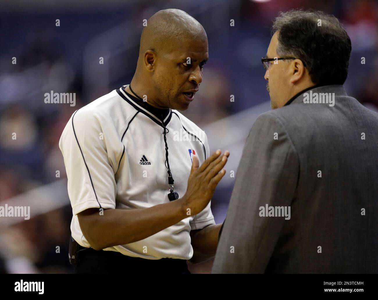 Referee Sean Corbin talks with Detroit Pistons head coach Stan Van ...