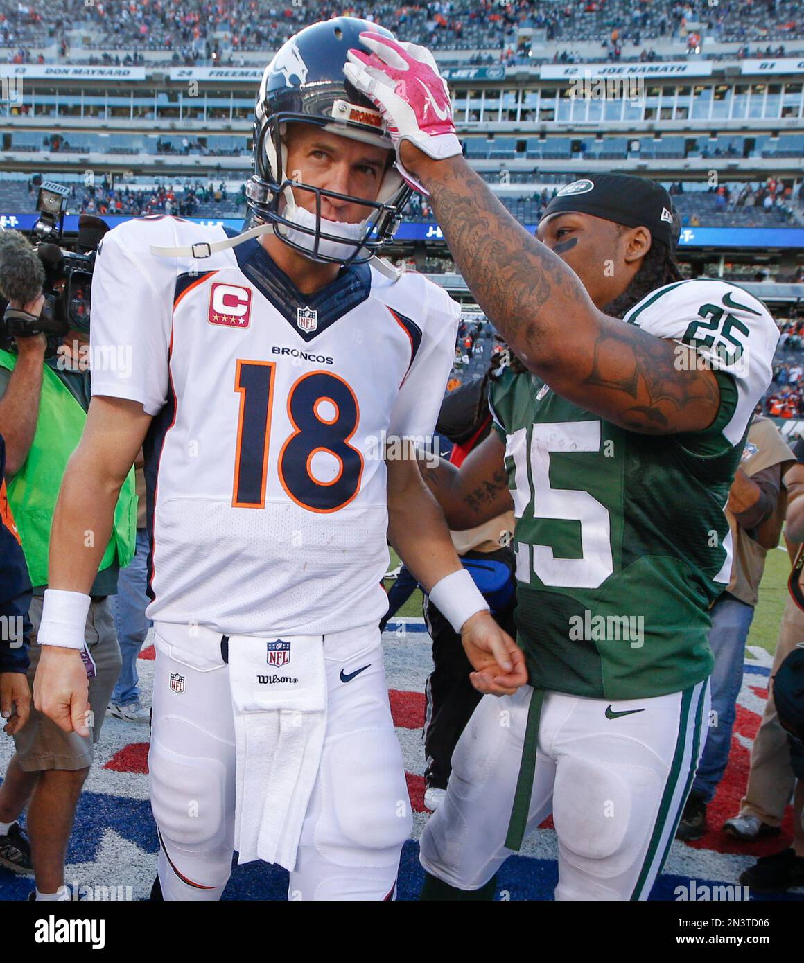 Denver Broncos quarterback Peyton Manning (18) is greeted by New York ...