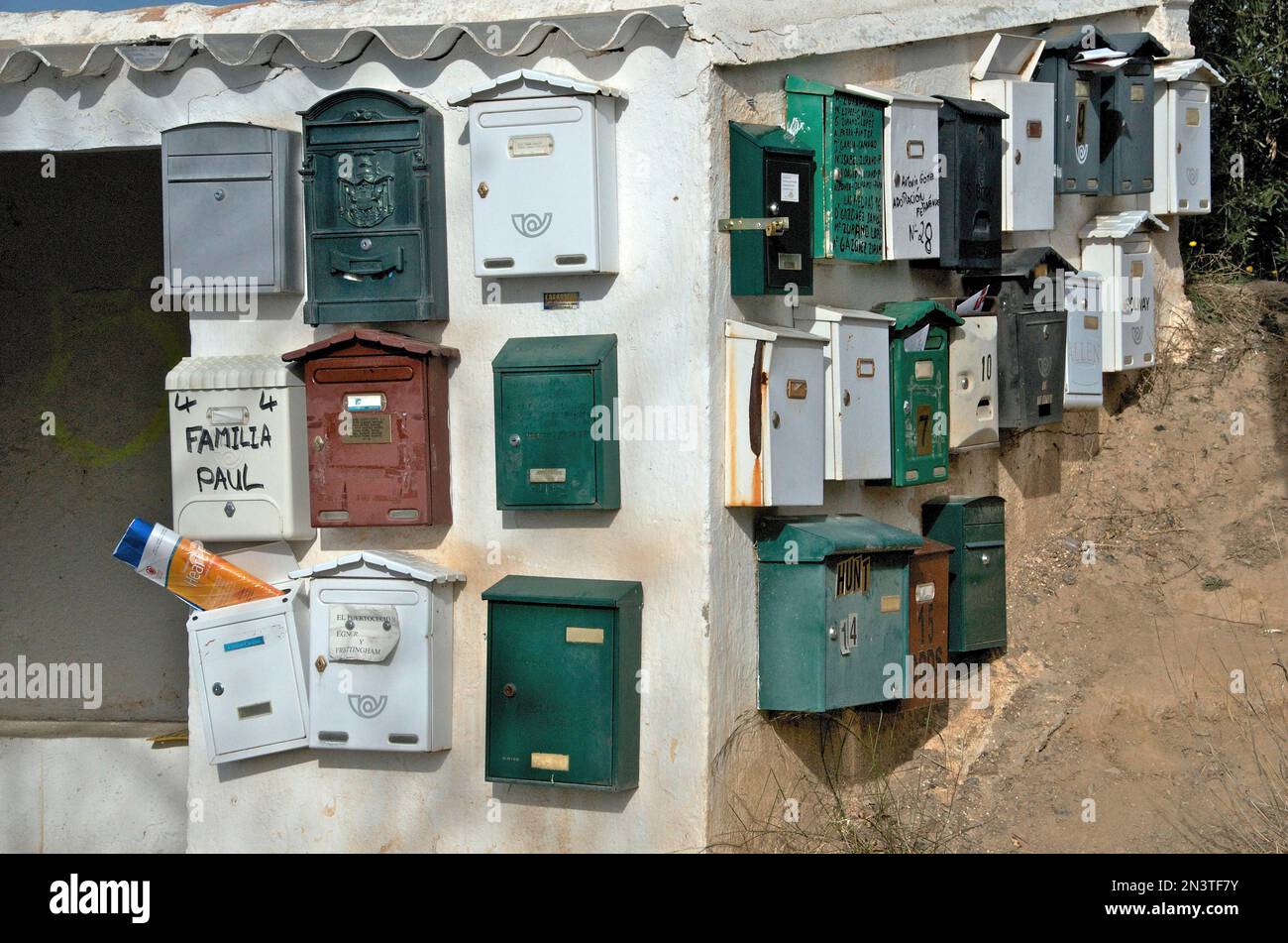Many letterboxes on one wall Stock Photo - Alamy