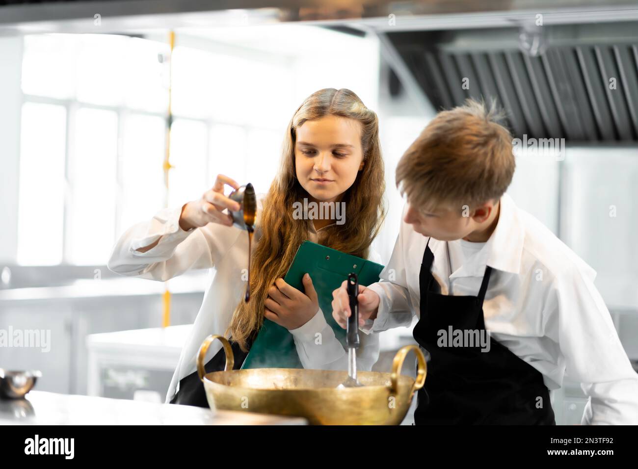 Students are learning to cook in a culinary institute with a standard ...