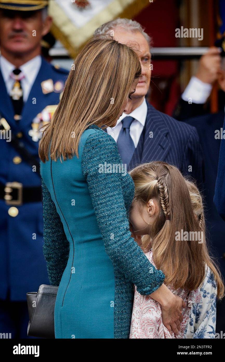 Spain's Crown Princess Leonor, right, is hugged by Spain's Queen ...