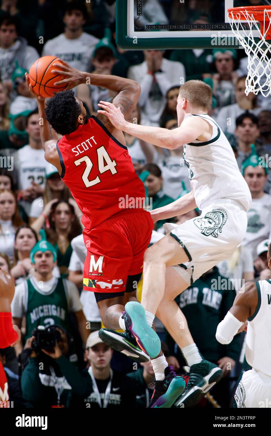 Maryland's Donta Scott, left, shoots against Michigan State's Joey ...