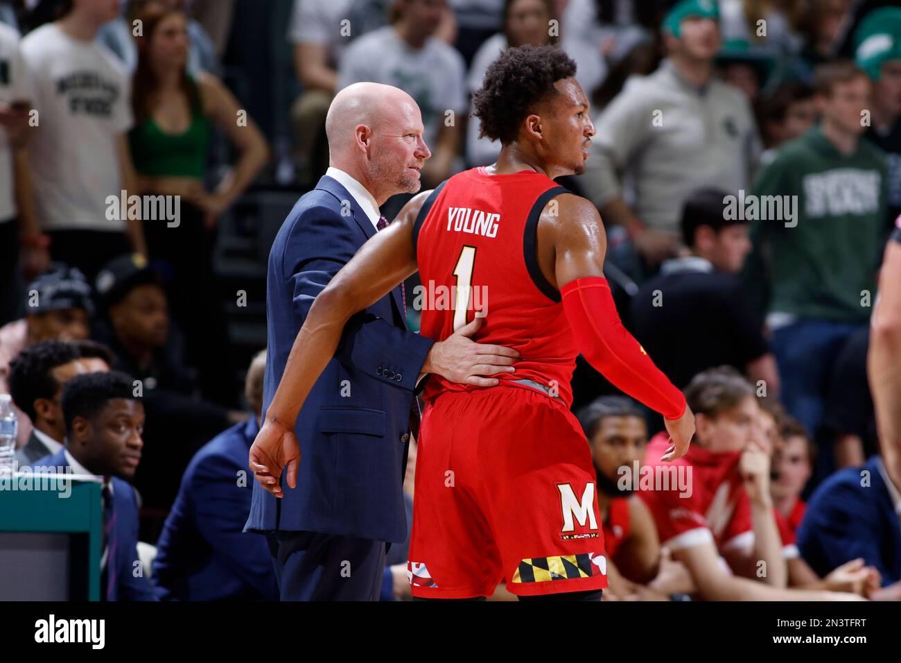 Maryland coach Kevin Willard, left, talks with Jahmir Young (1) during ...