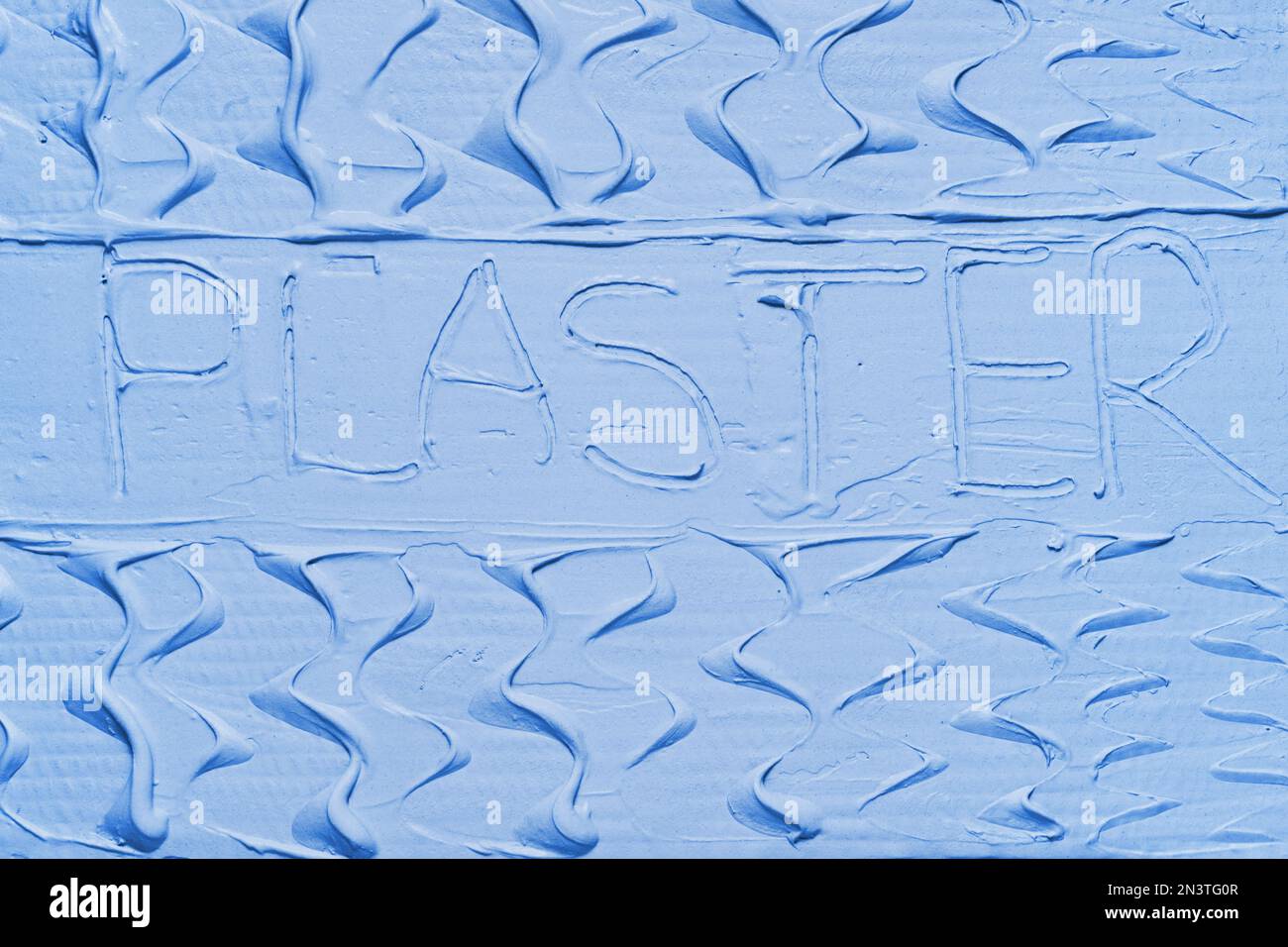 Blue texture of decorative putty wall with lettering plaster ...