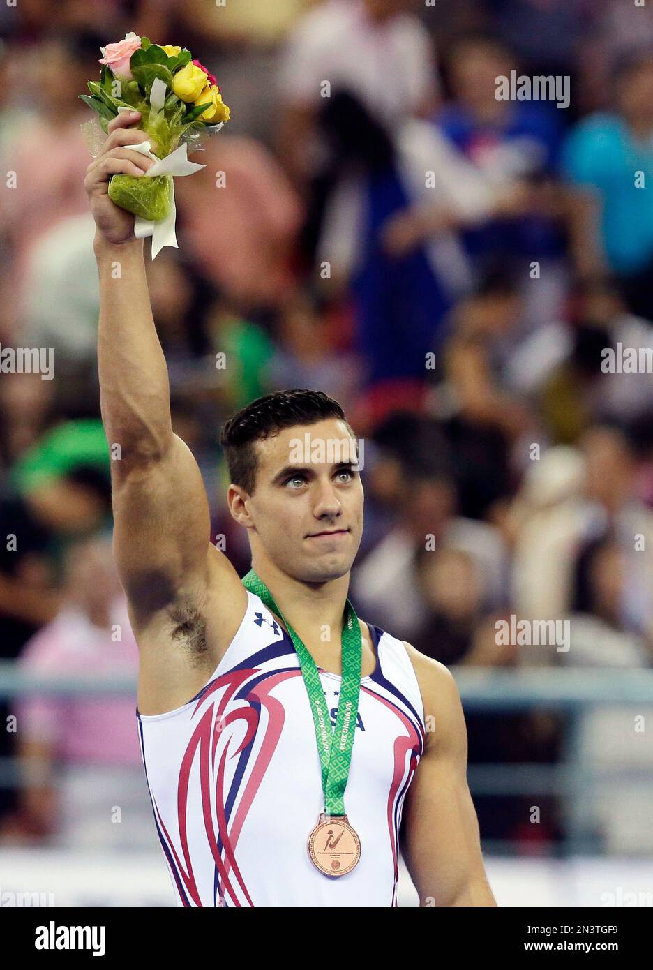 Bronze medalist Jacob Dalton of the United States celebrates on podium ...