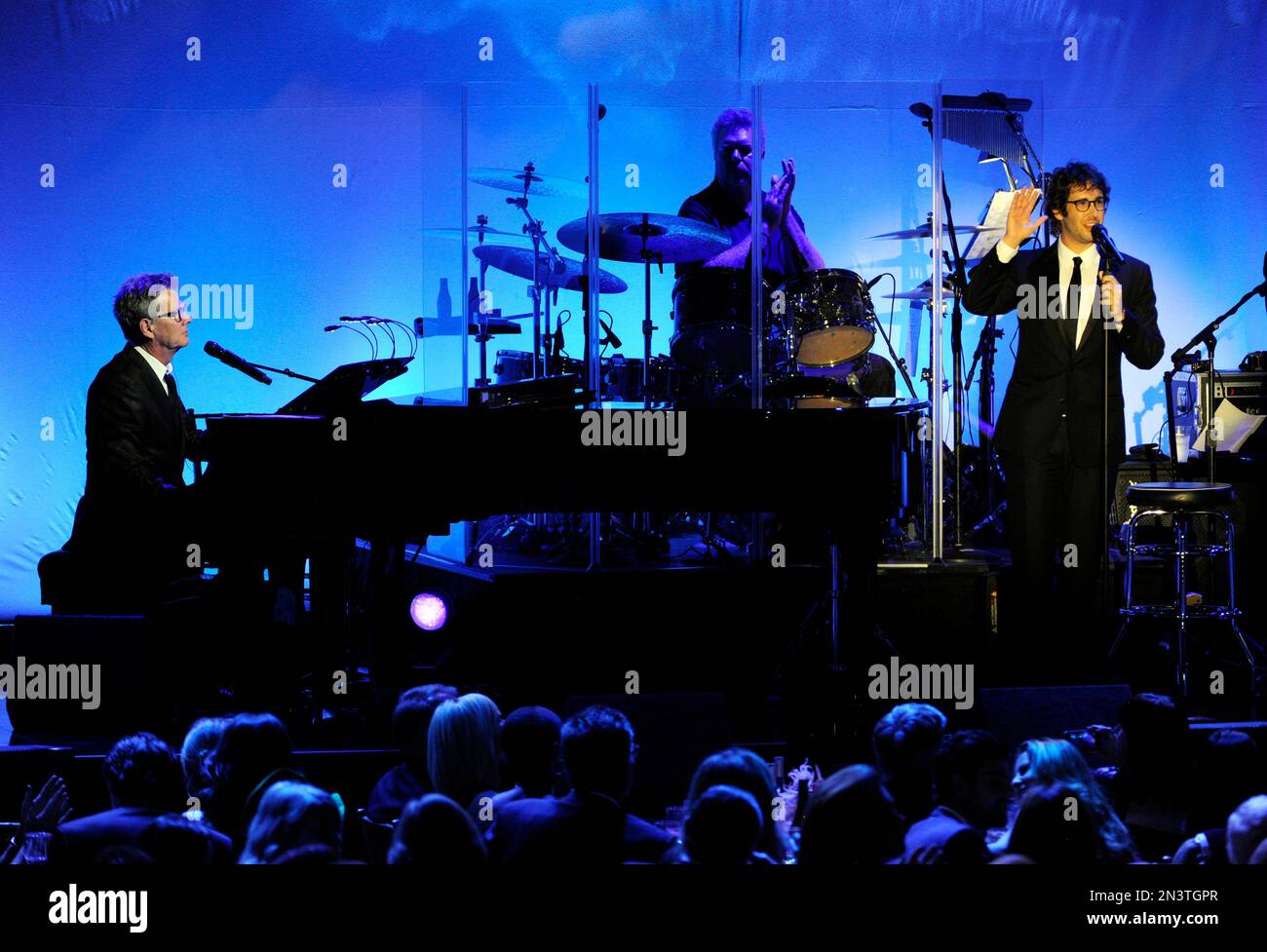 Singer Josh Groban, right, performs with David Foster, far left, during ...