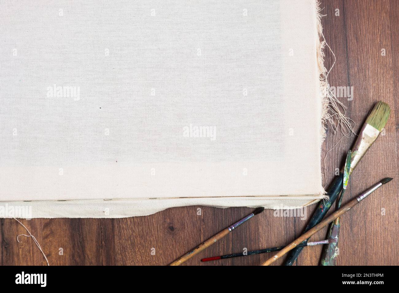 Canvas and paint brushes Stock Photo - Alamy