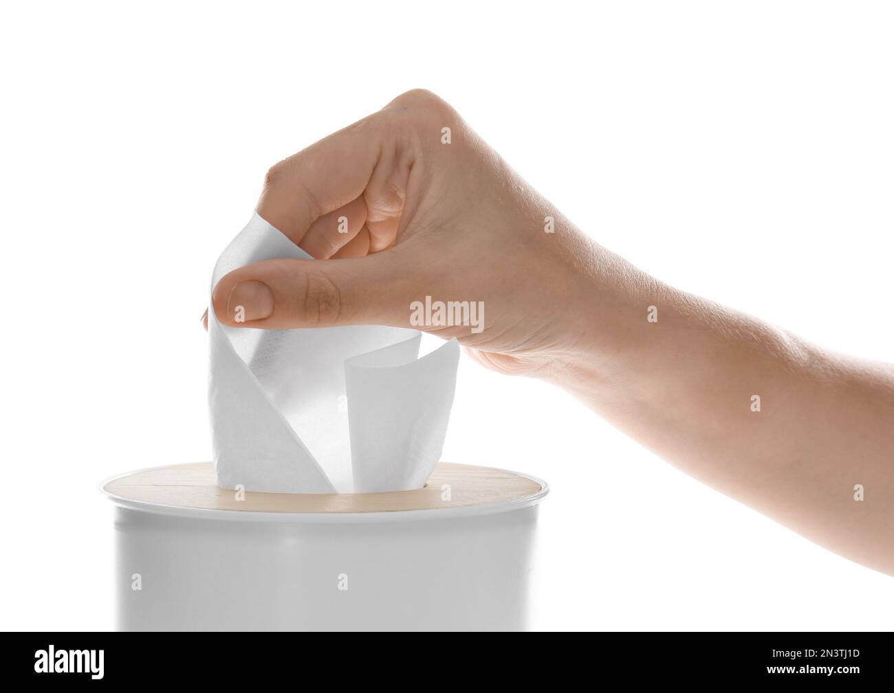 Woman taking paper tissue from holder on white background, closeup ...