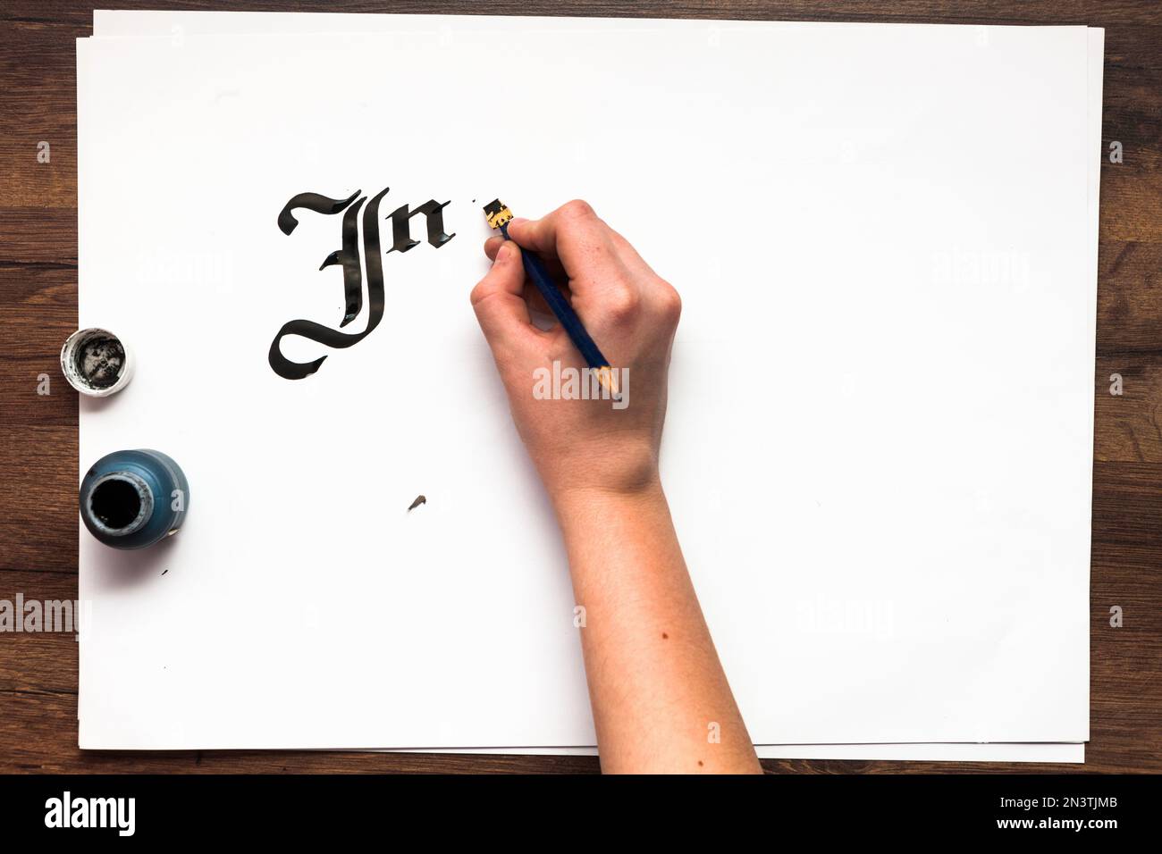 Calligraphy lettering. Artist workplace top view Stock Photo - Alamy