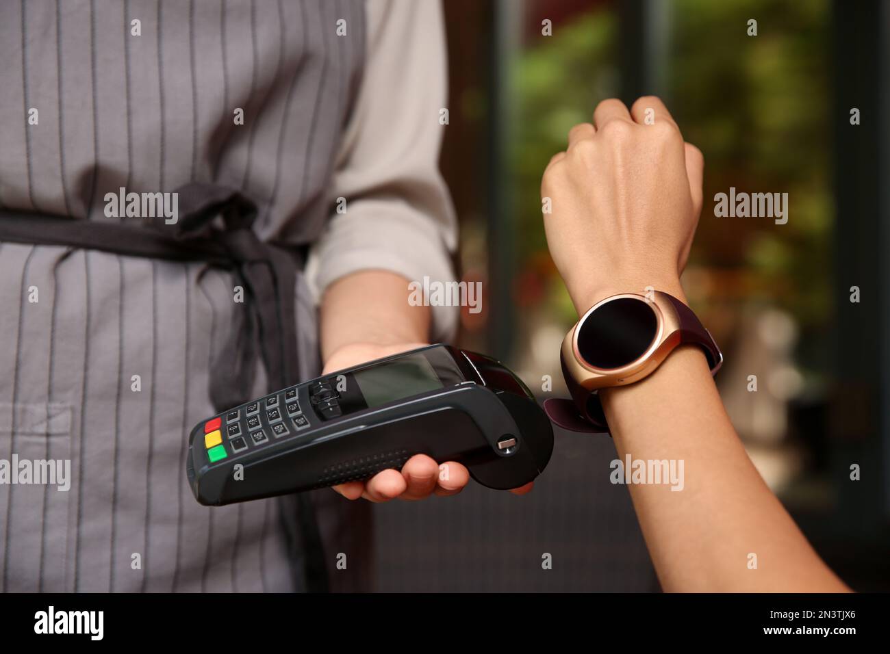 Female pay smart watch hi-res stock photography and images - Alamy